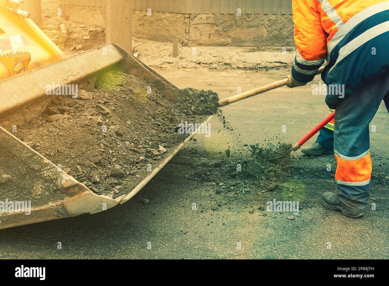 Construction workers in orange uniforms hi-res stock photography and ...