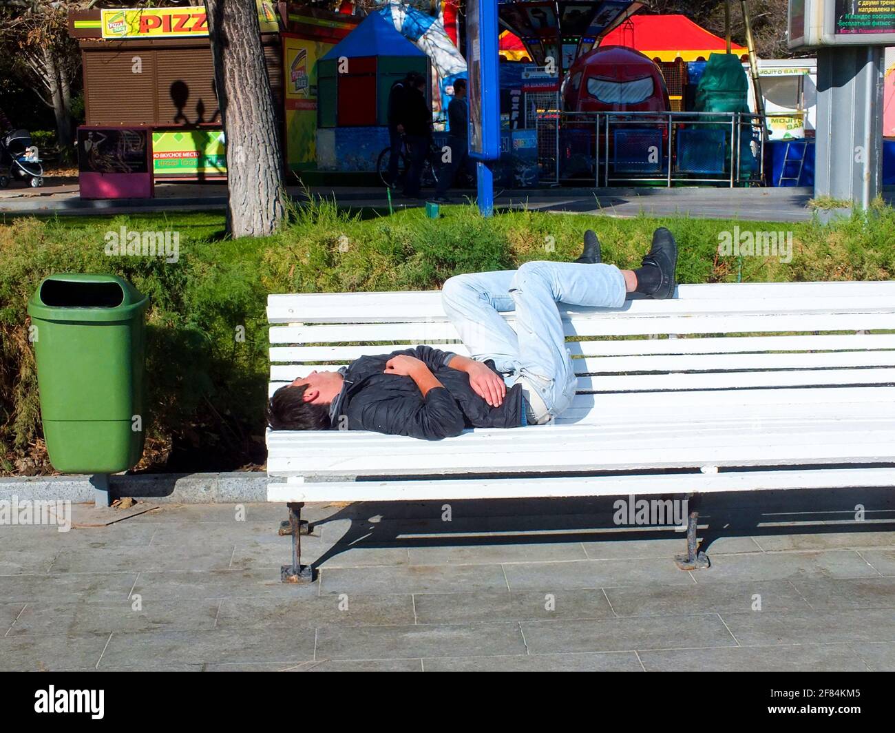 Homeless man sleep on bench hi-res stock photography and images - Alamy