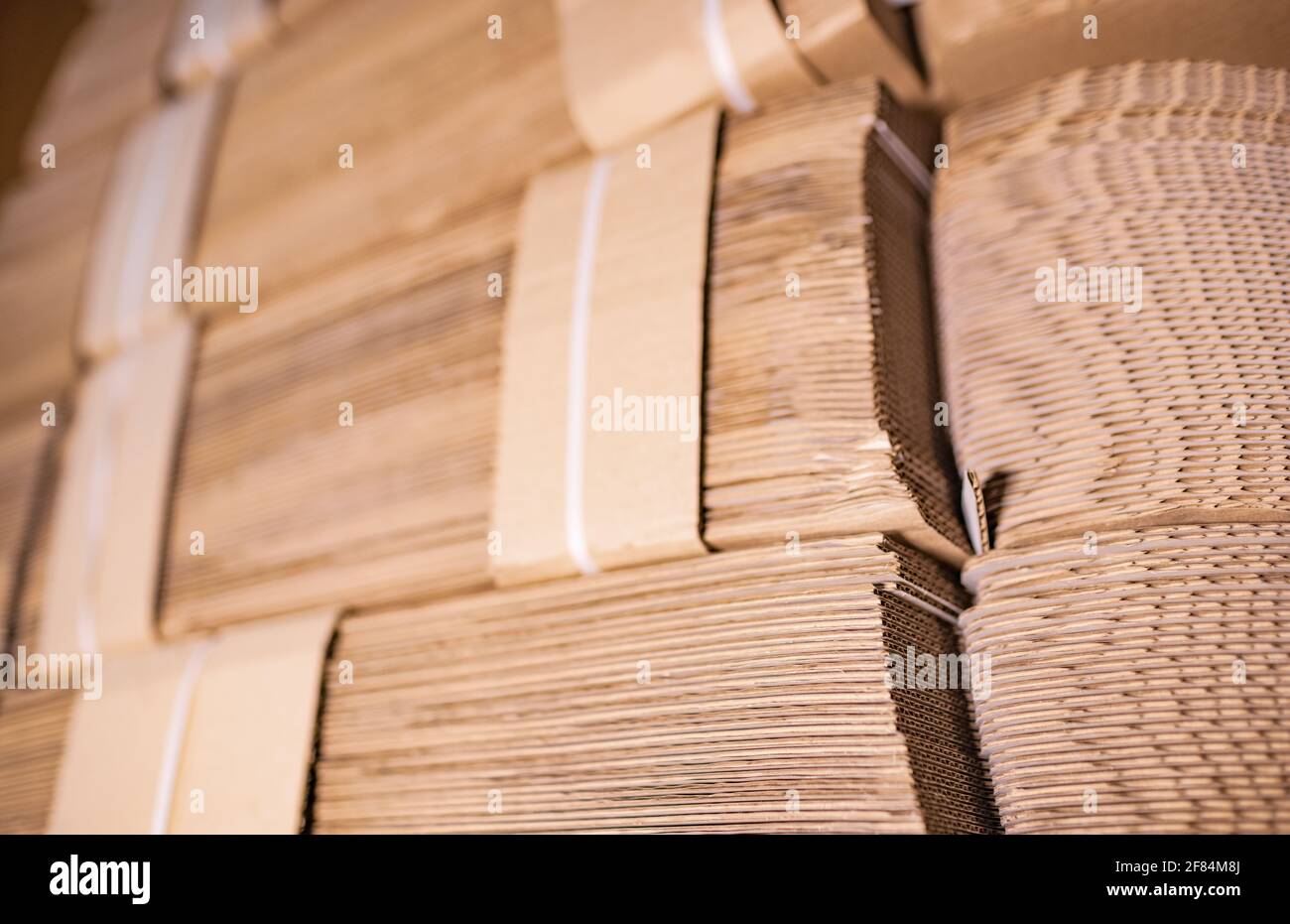 Close-up large cardboard piles lie on top Stock Photo - Alamy