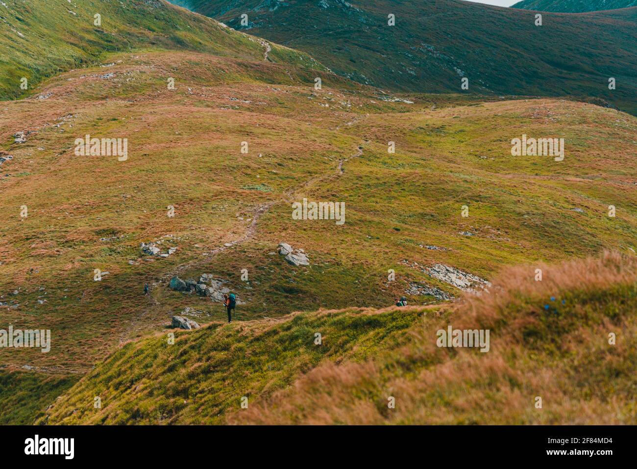 Tourist couple enjoys the views of the Montenegrin ridge, mountain ...