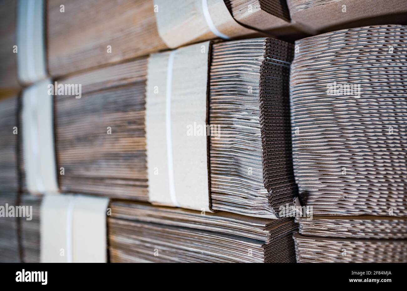 Close-up sides of stacks of cardboard folded Stock Photo - Alamy