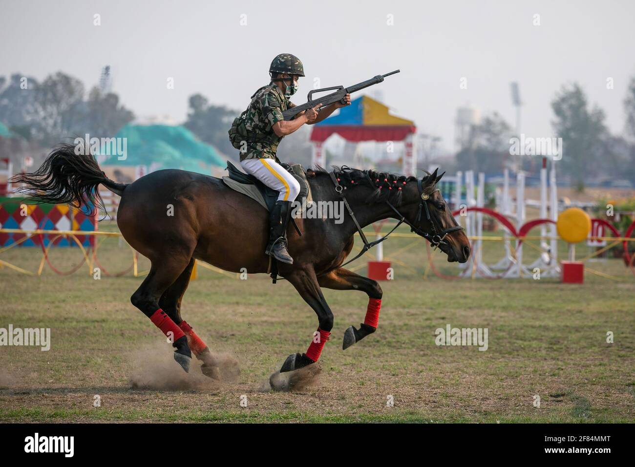 A Nepalese soldier performs horse riding skills during the "Ghodejatra ...