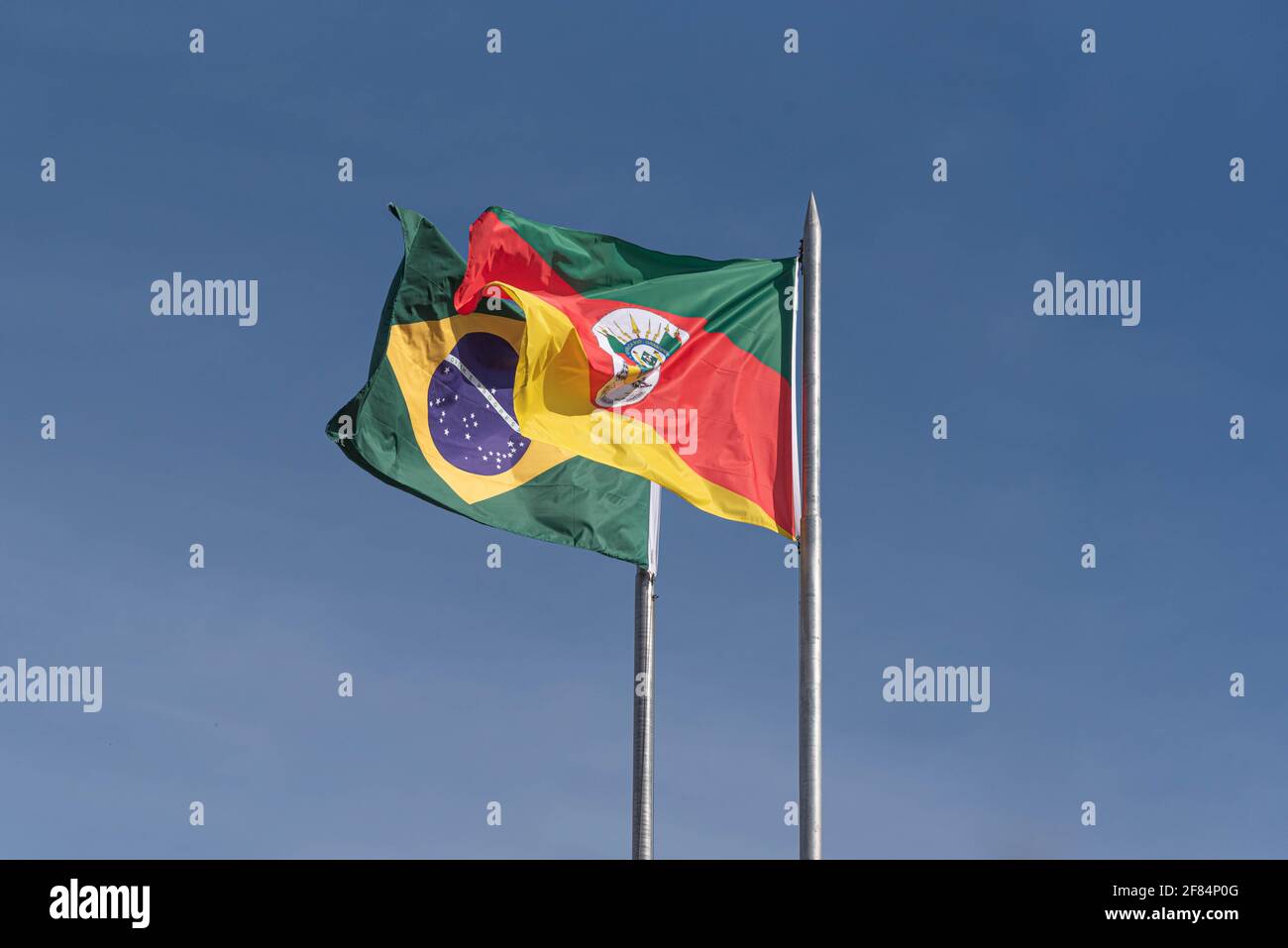 Flags of the state of Rio Grande do Sul and Brazil on blue natural ...