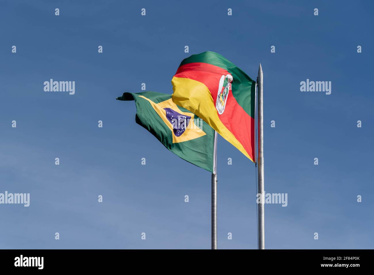 Flags of the state of Rio Grande do Sul and Brazil on blue natural ...