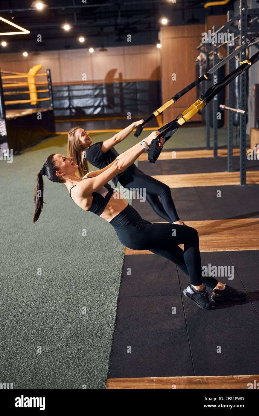 Excited female athletes working out at the local gym Stock Photo - Alamy