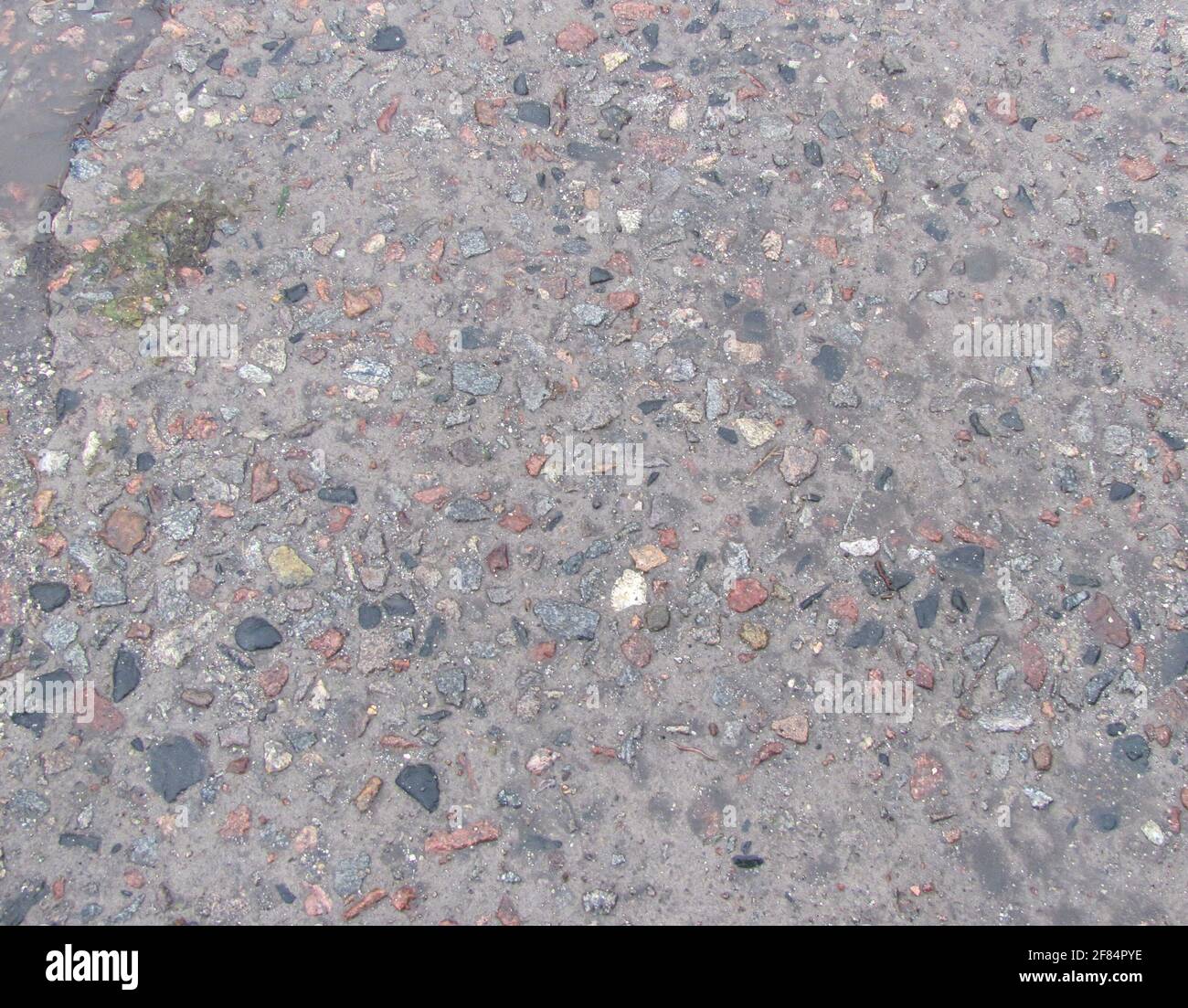wet concrete texture background with small stones in it Stock Photo - Alamy