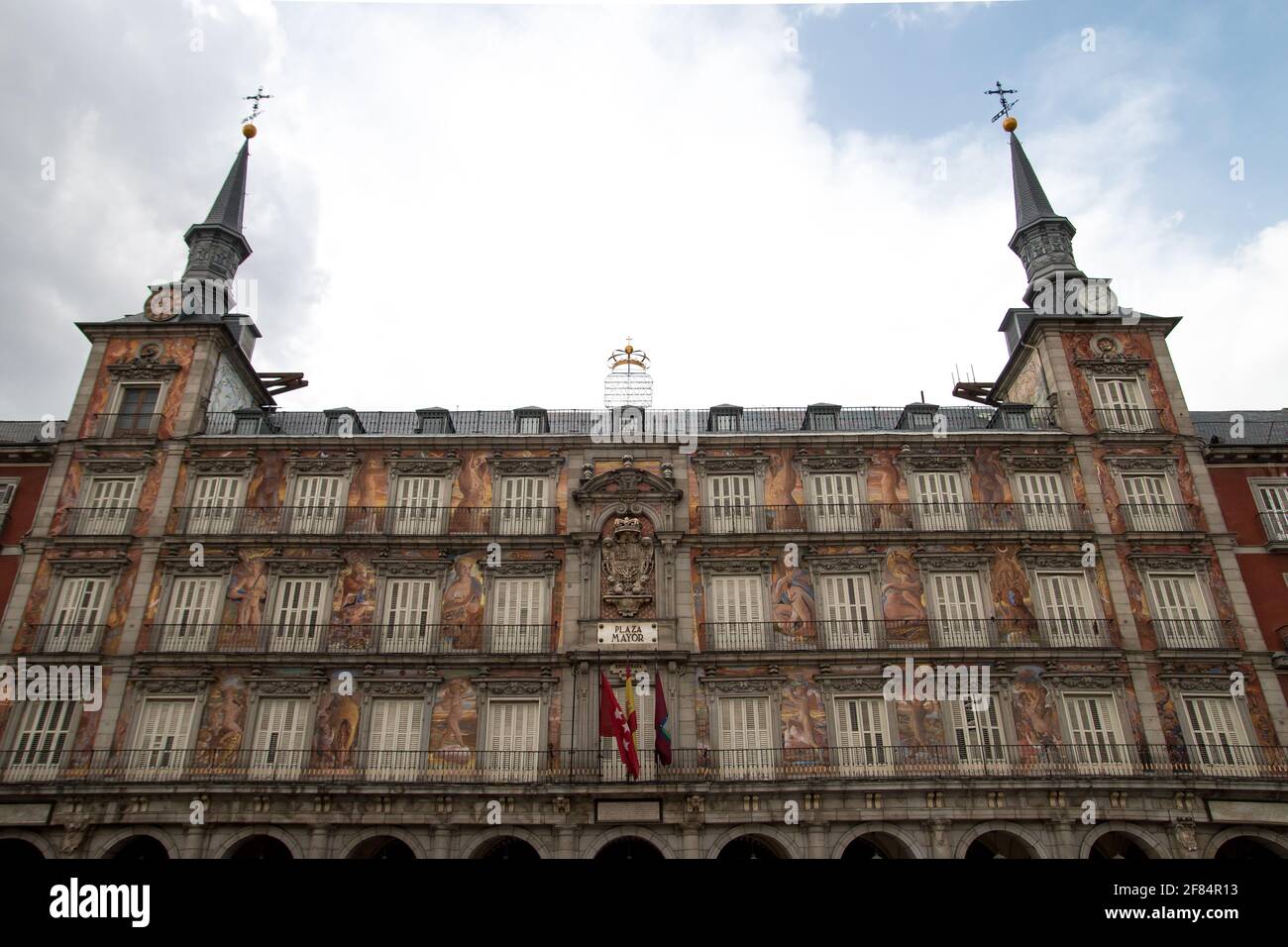 A low angle shot of the plaza Mayor building under a cloudy sky in ...