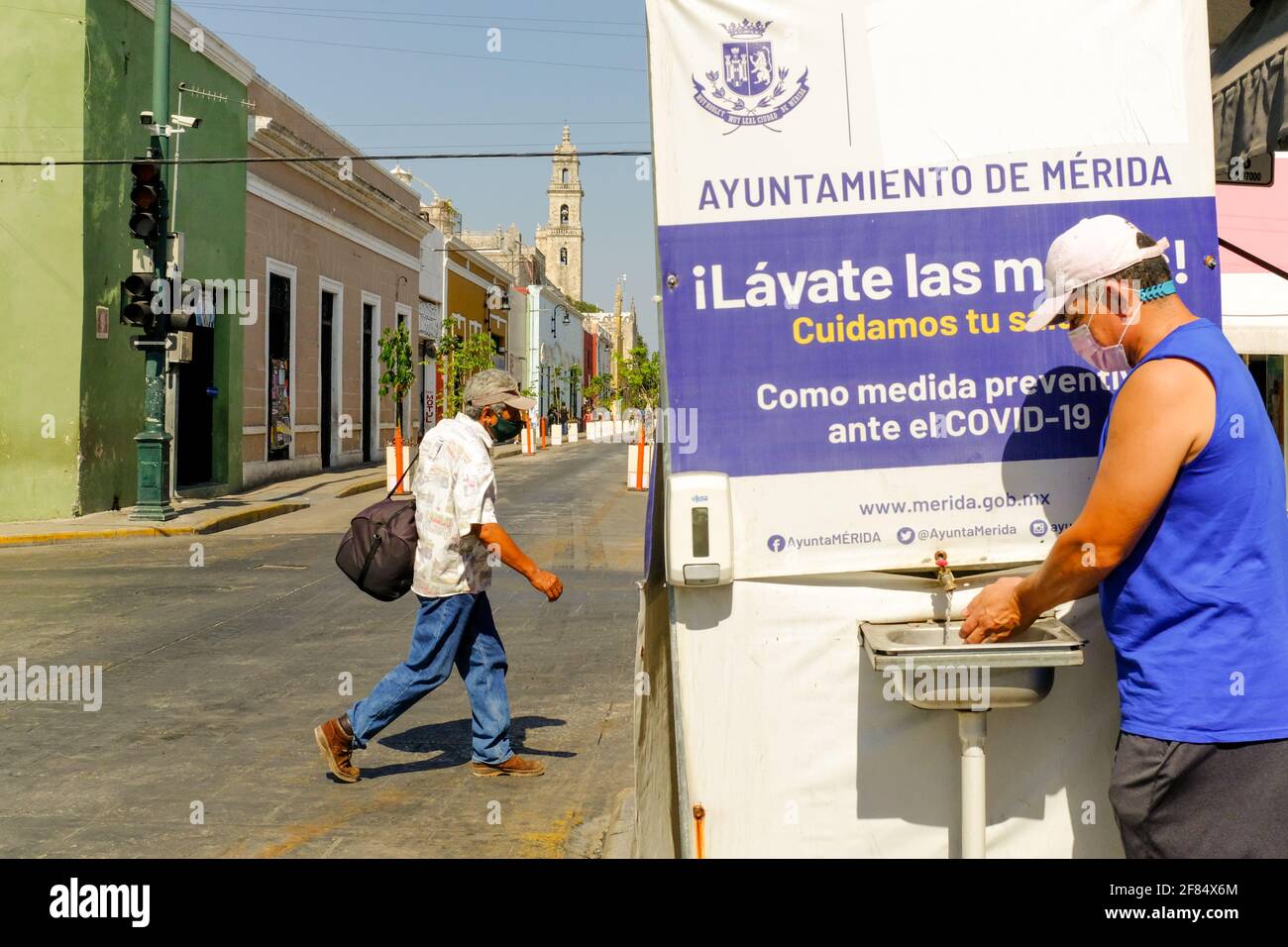 Man washing his hands in a Mobile handwashing station in Merida, Mexico ...