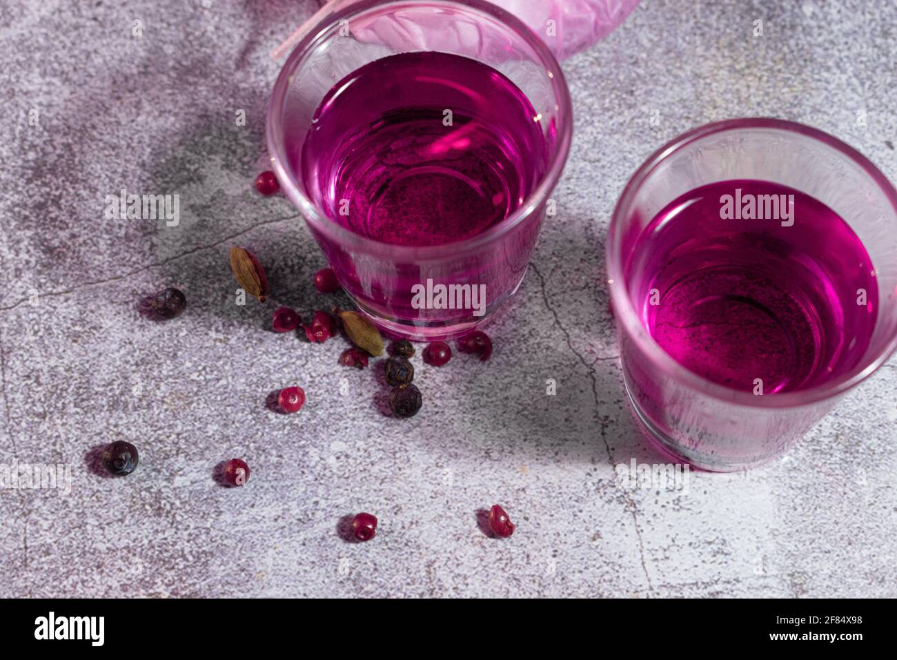 pink alcoholic drink in glass shot glasses Stock Photo - Alamy
