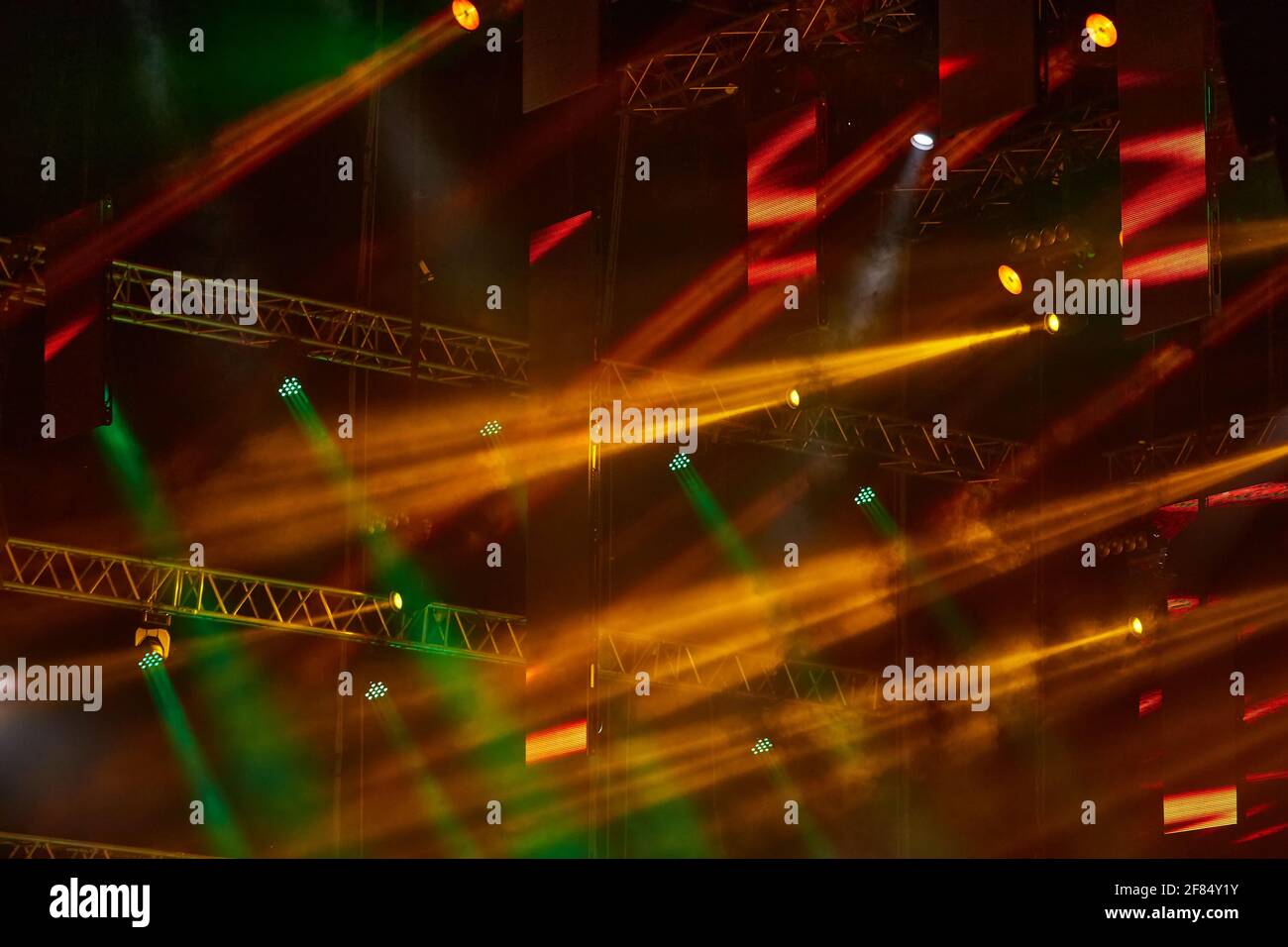 Yellow and orange foggy show lights during rock concert Stock Photo - Alamy