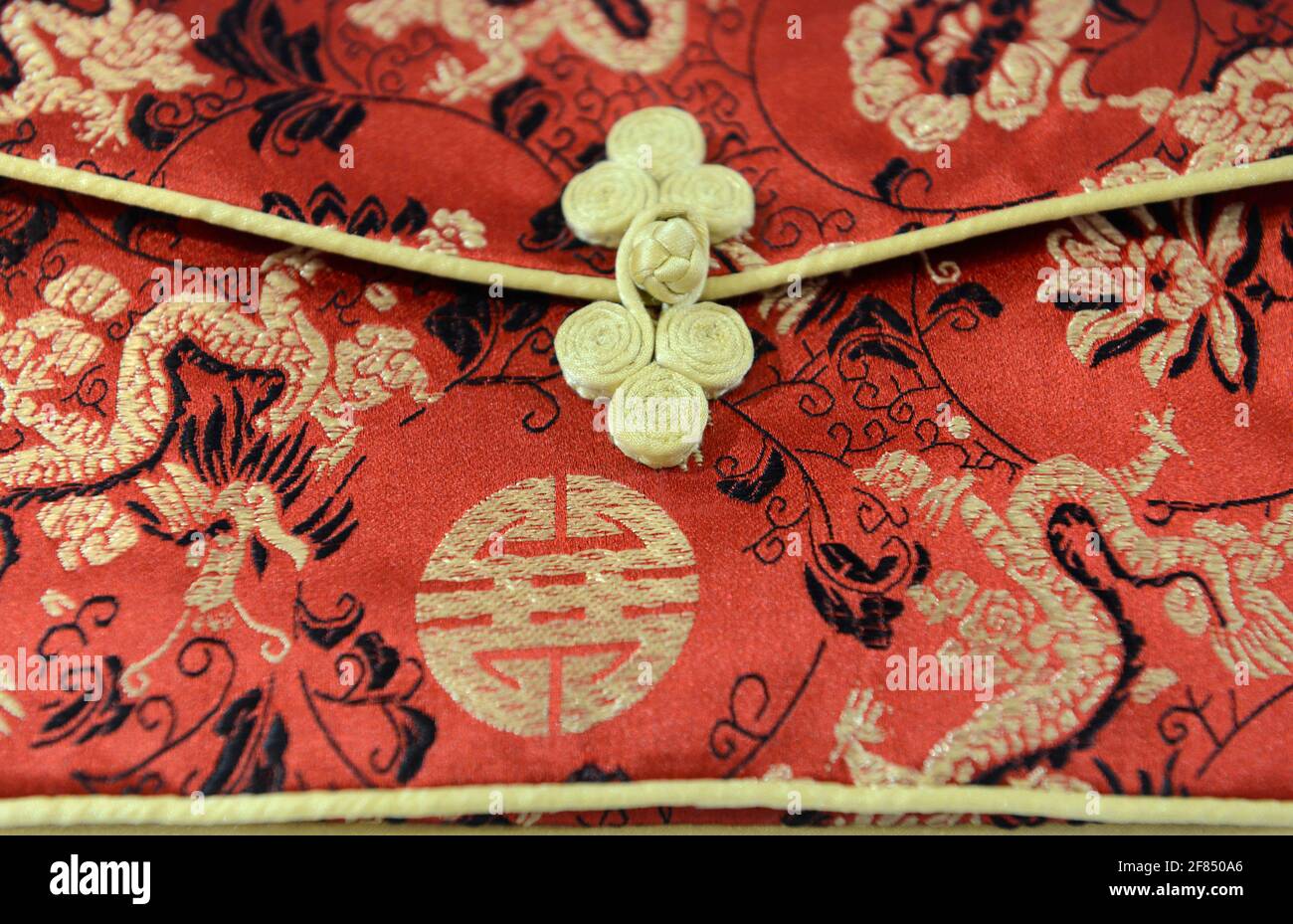 Simple floral cloth button, called a Pankou in Chinese, on a ...