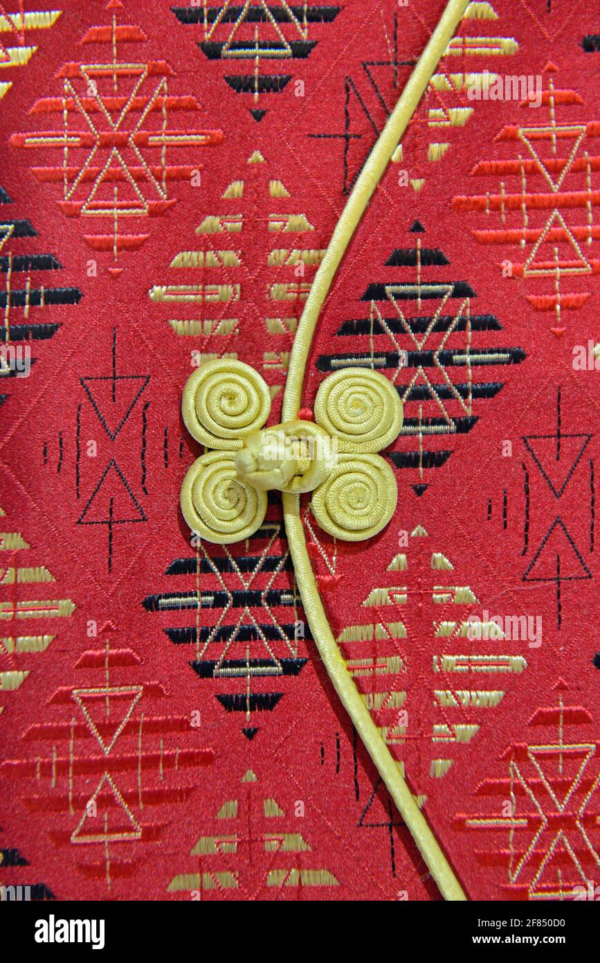 Simple floral cloth button, called a Pankou in Chinese, on a ...
