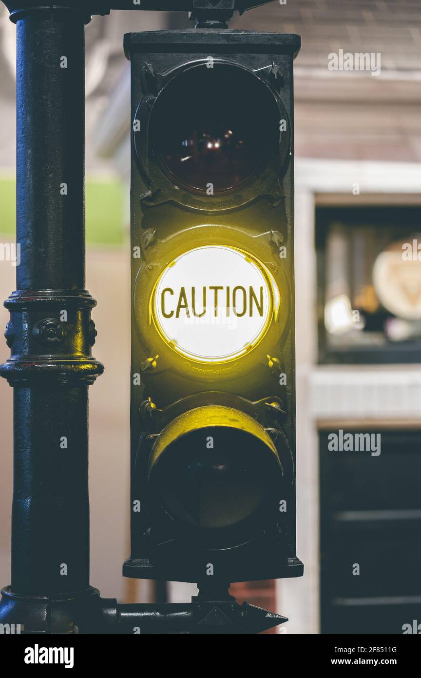 The caution word on a traffic light Stock Photo - Alamy