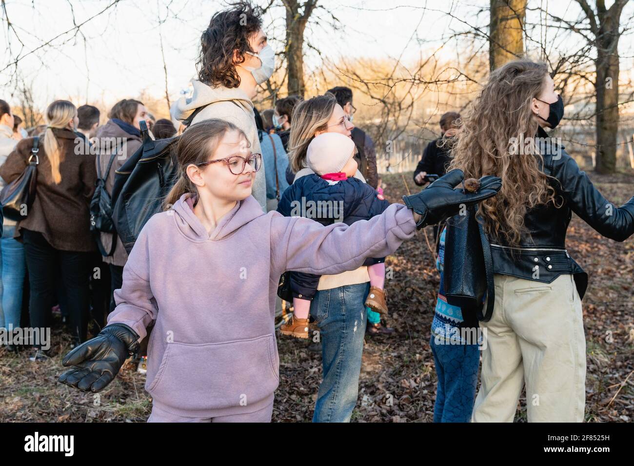 Volunteer girl releases a bat, raising her hand up Stock Photo - Alamy