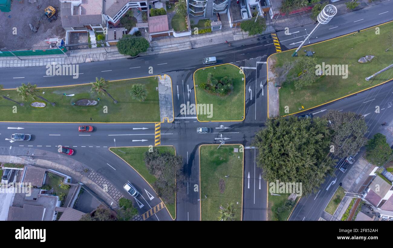 Aerial view of an intersection with vehicles and zebra lines Stock ...
