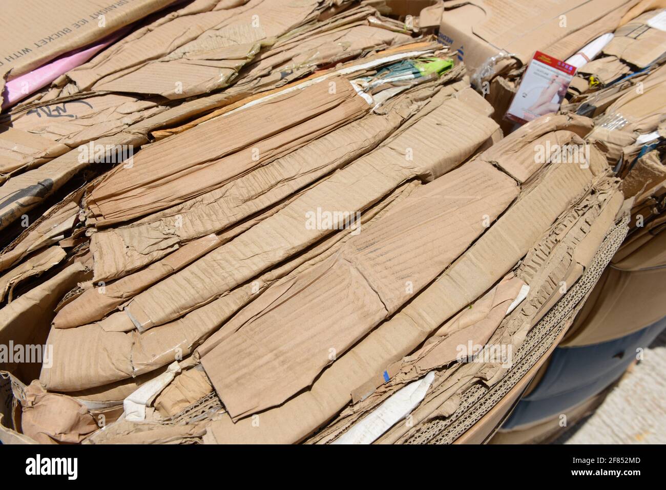 Flattened cardboard packaging ready to be taken for recycling in ...