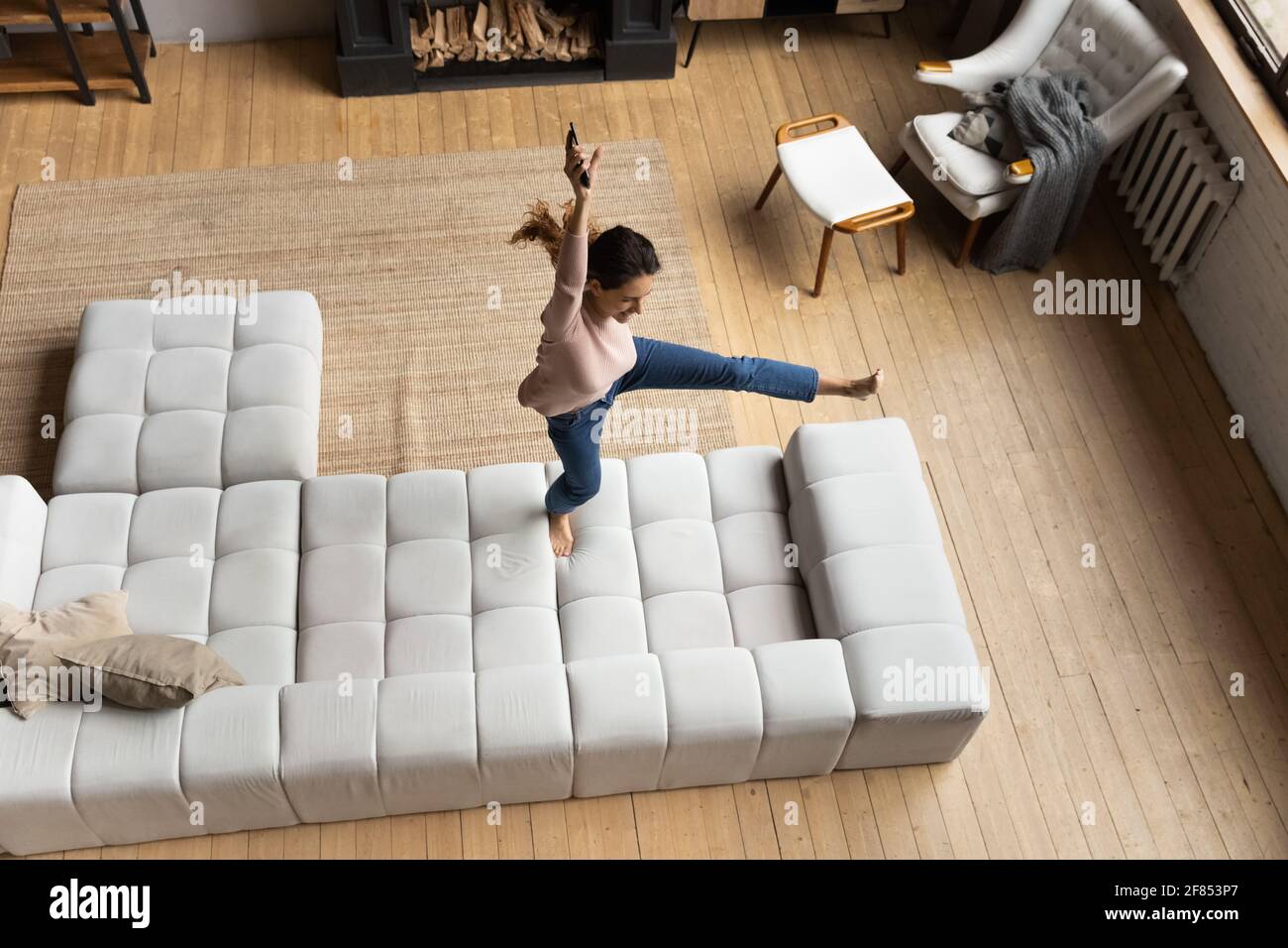 Jump on sofa hi-res stock photography and images - Alamy