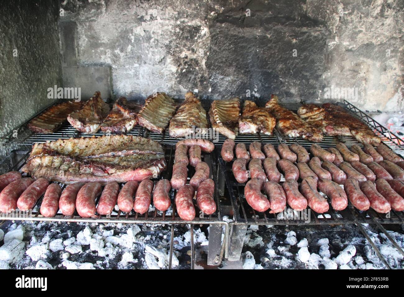 Mixed meat with ribs of beef and sausage on the grill Stock Photo - Alamy