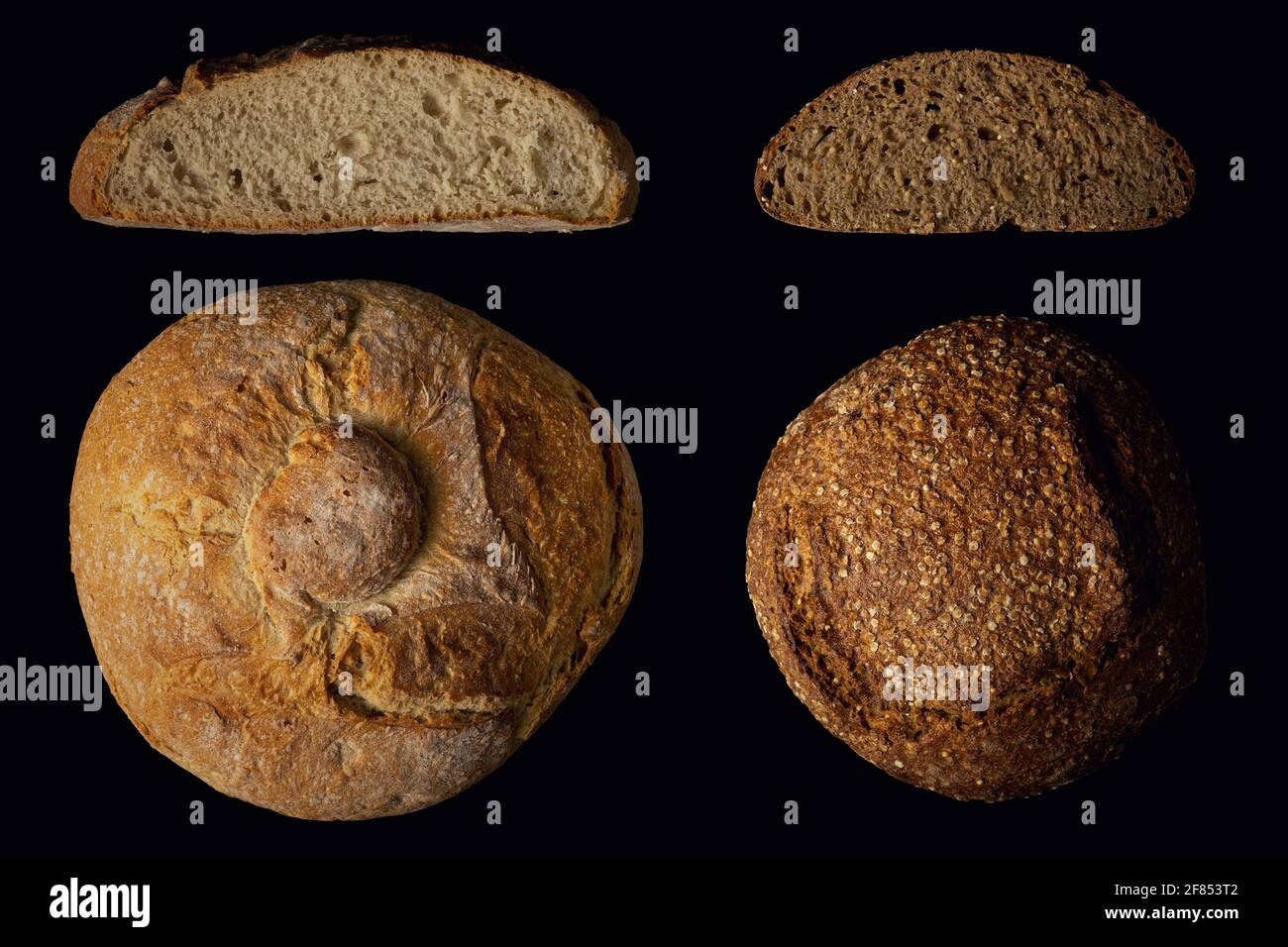 Two different types of bread with one slice of each isolated on a black ...