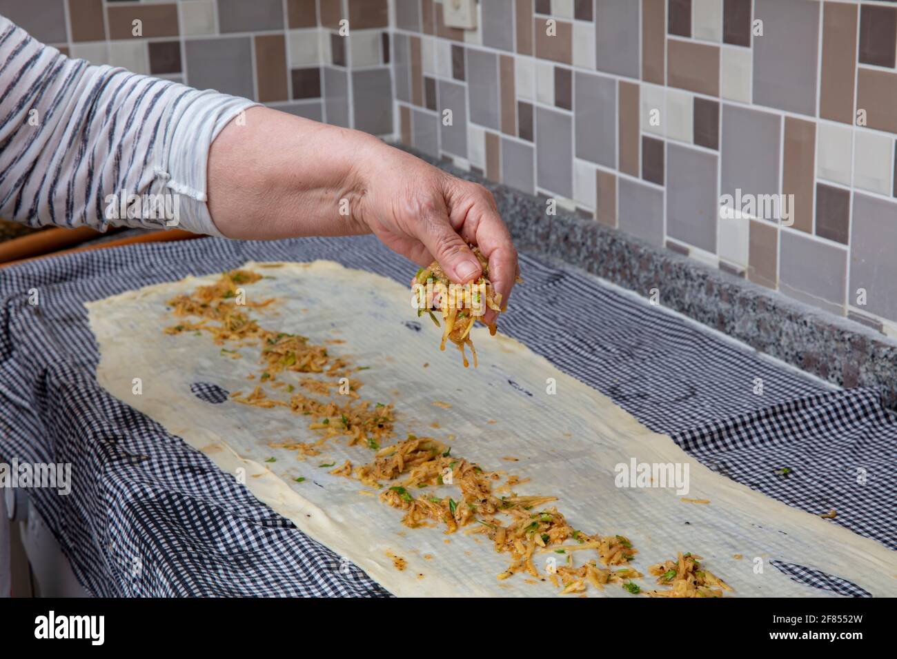 Bosnian borek. Homemade rolled borek, spinach, potato and feta cheese ...