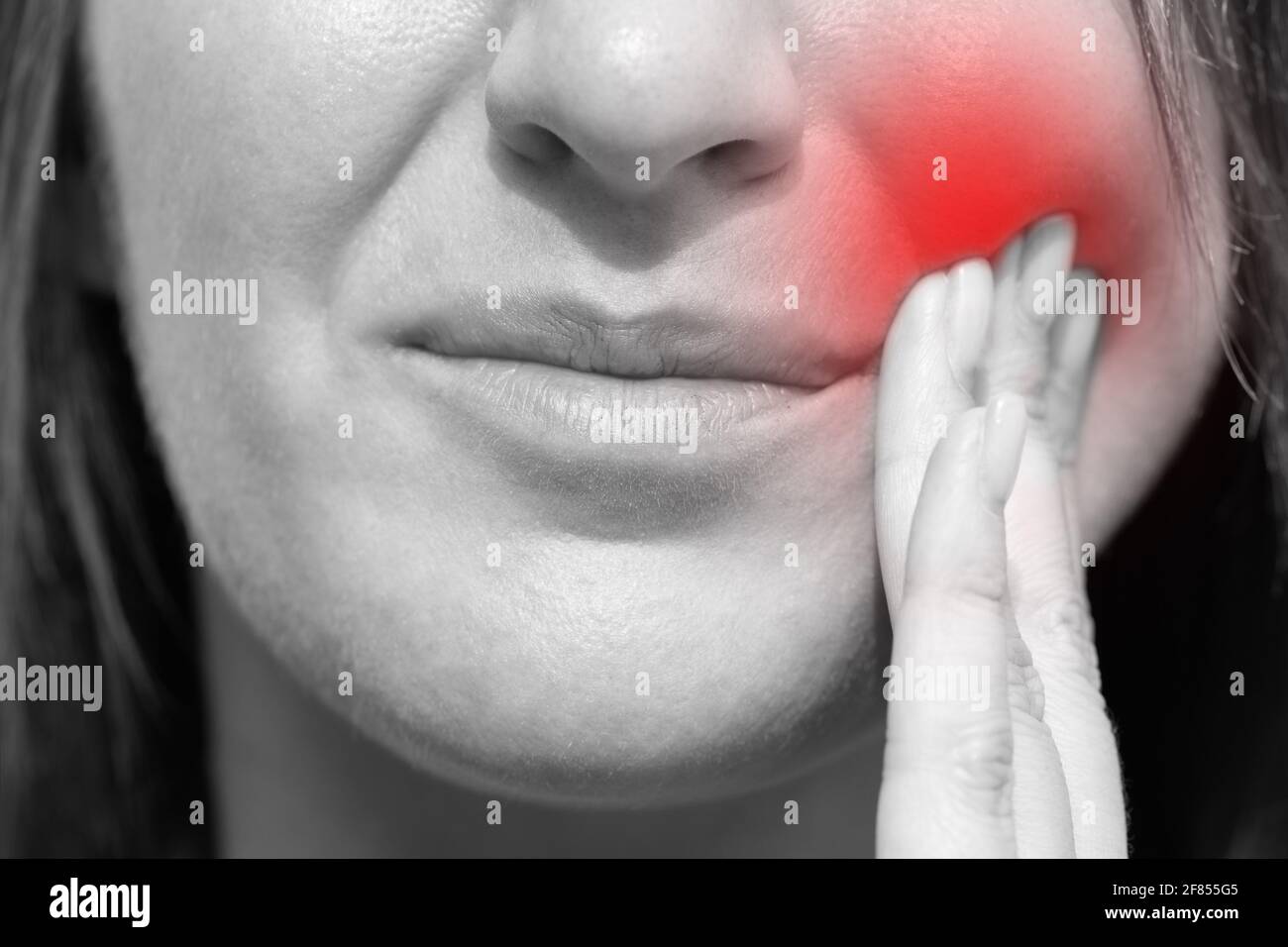 Closeup of woman face feeling tooth pain with red highlighted area ...