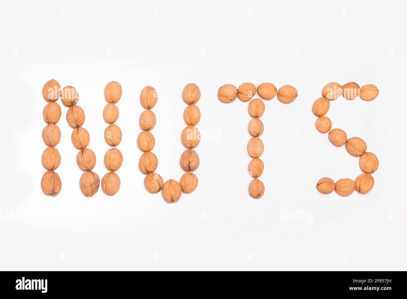 Nuts word laid out from walnuts on white background, isolated Stock ...