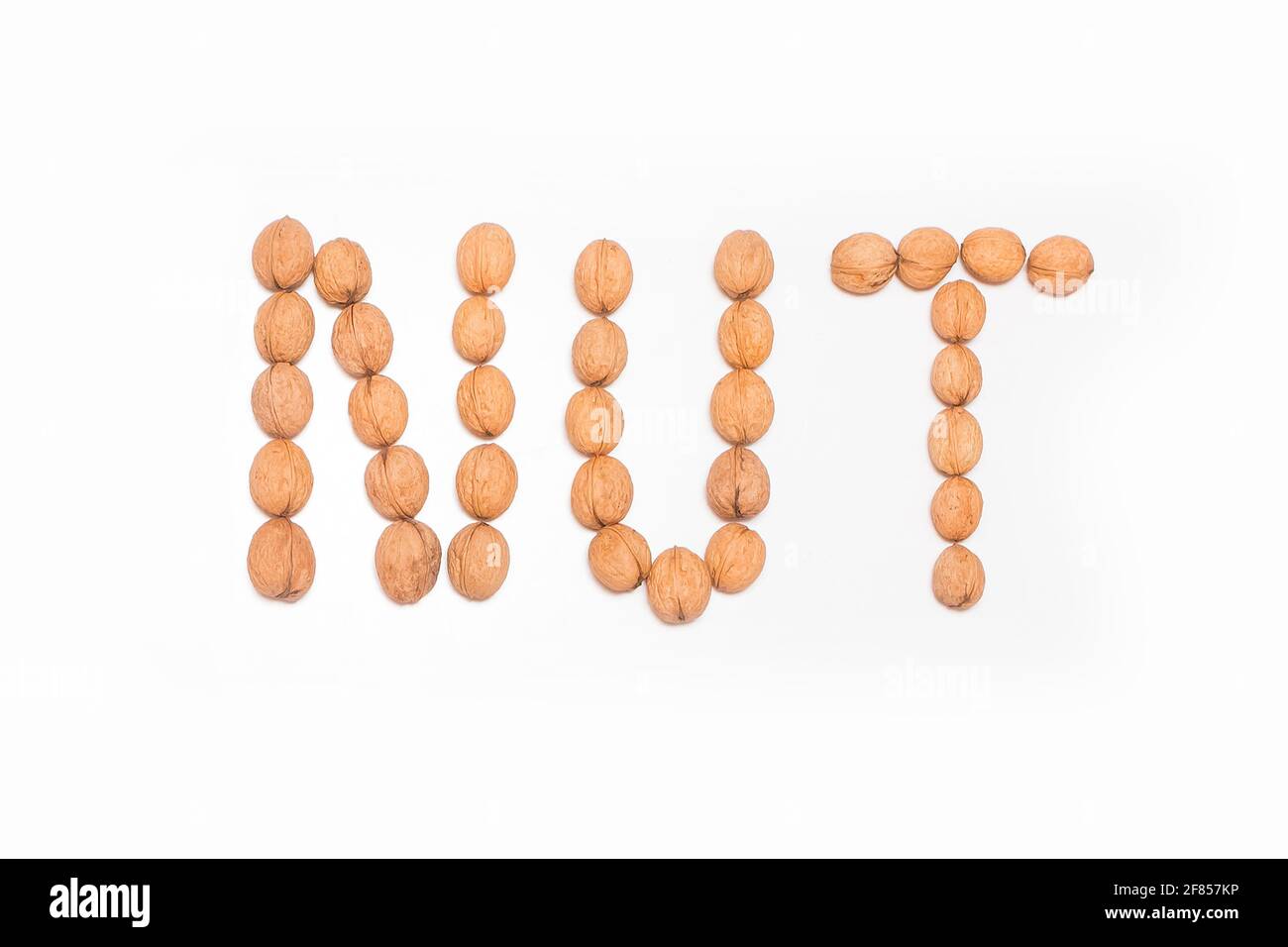 Nut word laid out from walnuts on white background, isolated Stock ...