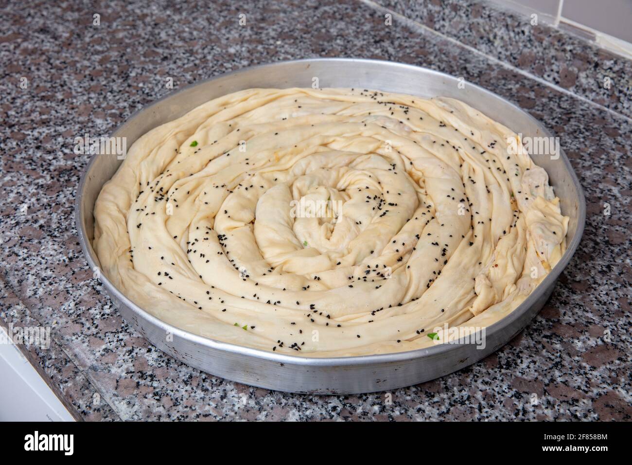 Bosnian borek. Homemade rolled borek, spinach, potato and feta cheese ...