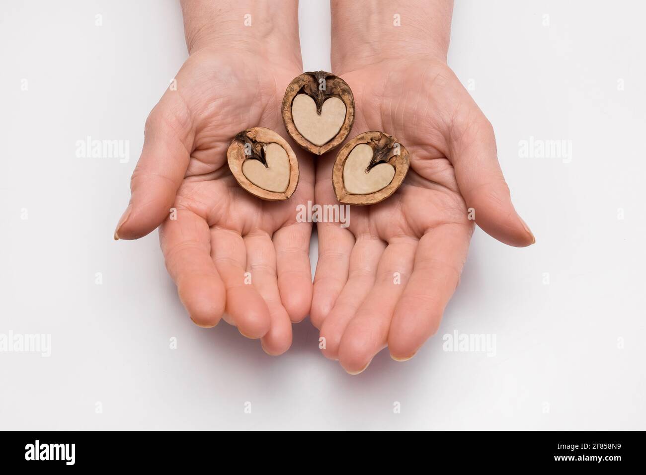 Hand full of nuts hi-res stock photography and images - Alamy
