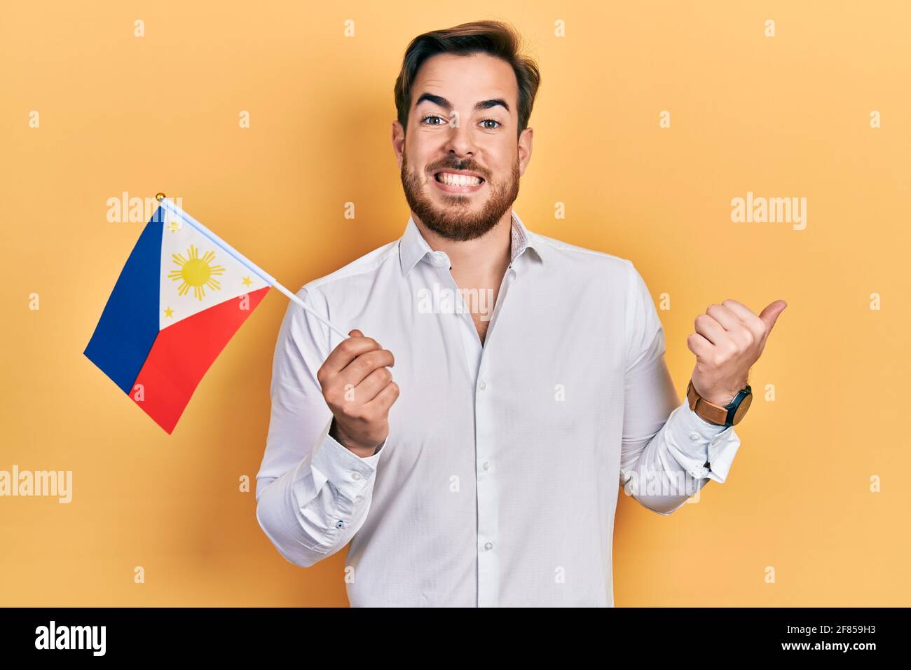 Male hand holding philippine flag hi-res stock photography and images ...