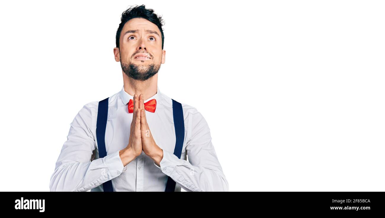 Hispanic man with beard wearing hipster look with bow tie and ...