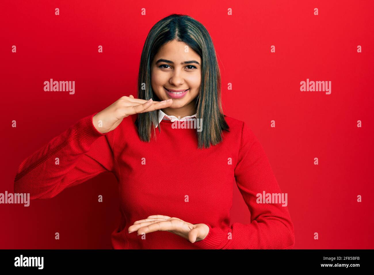 Young latin woman wearing casual clothes gesturing with hands showing ...