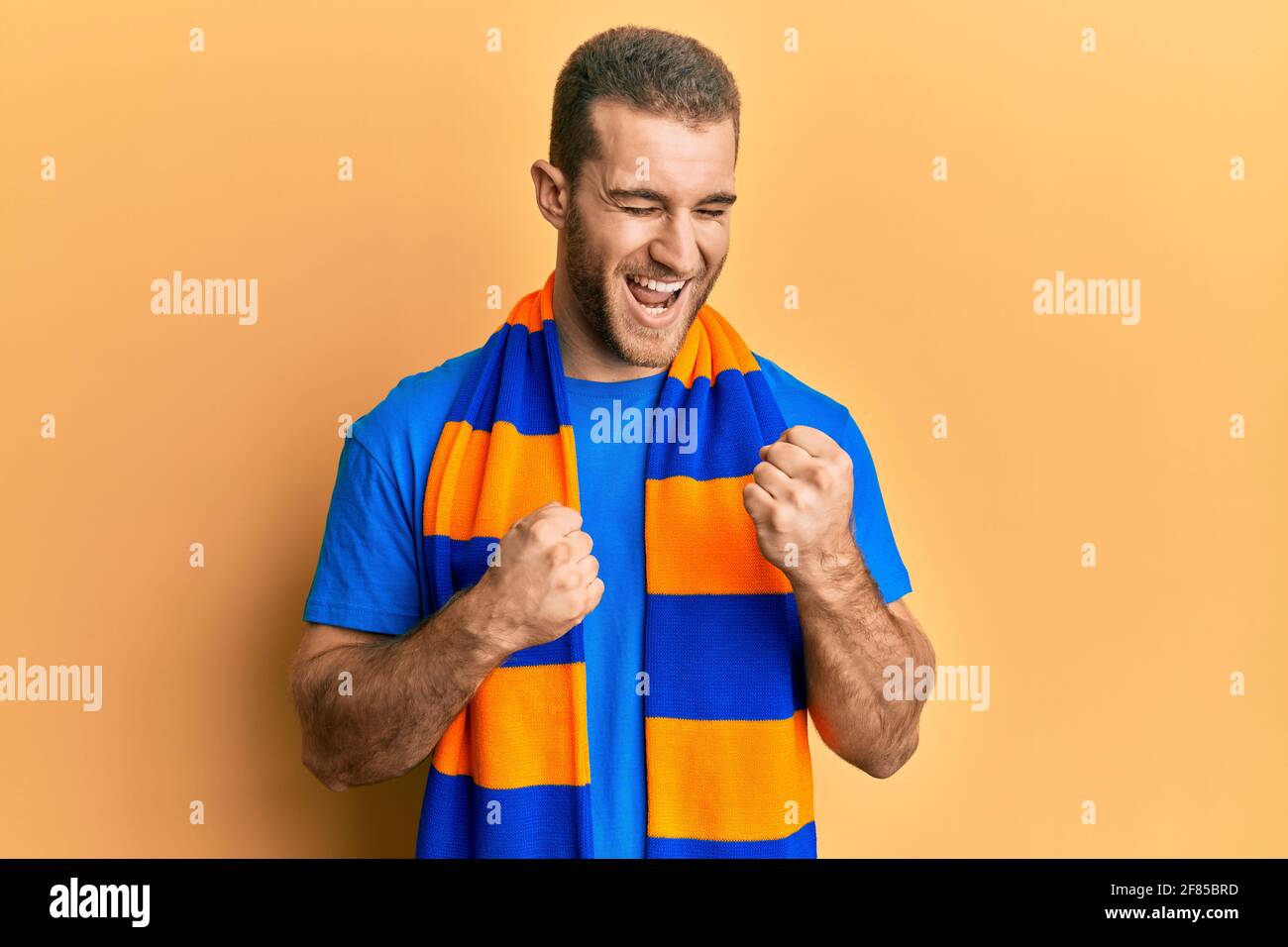 Young caucasian man football hooligan cheering game celebrating ...