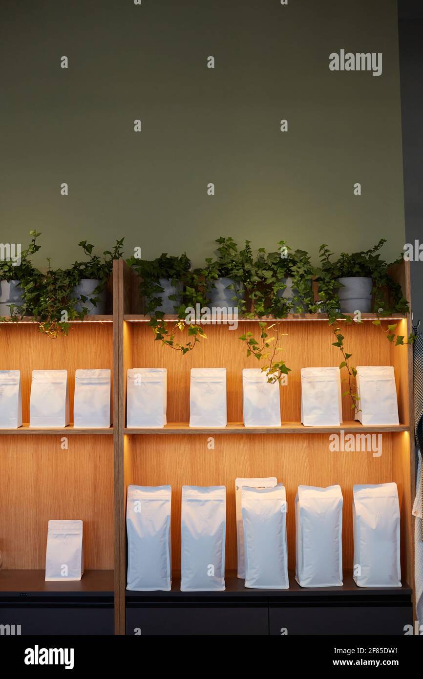 Vertical background image of shelves in coffee shop or tea cafe with ...