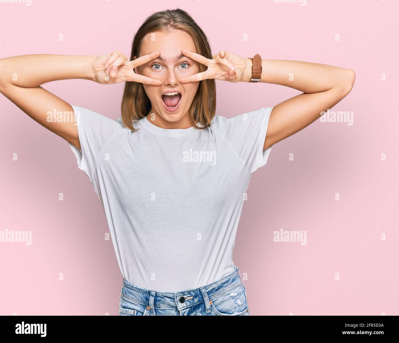 Beautiful Young Blonde Woman Wearing Casual White T Shirt Doing Peace
