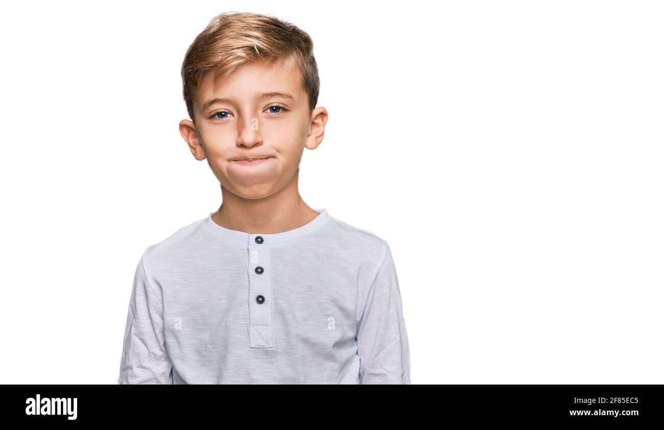 Little caucasian boy kid wearing casual clothes puffing cheeks with ...