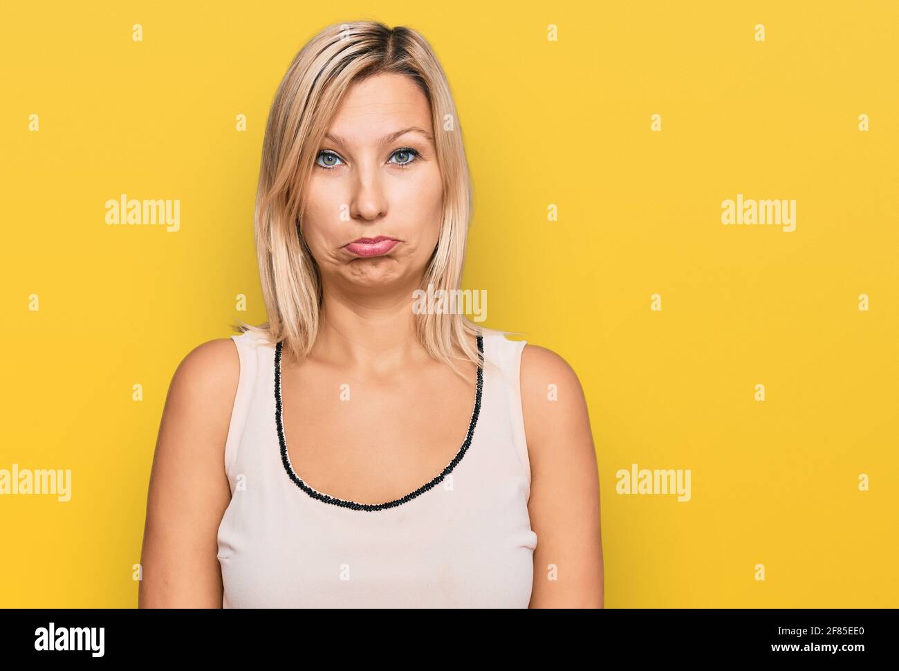 Middle age caucasian woman wearing casual clothes depressed and worry ...