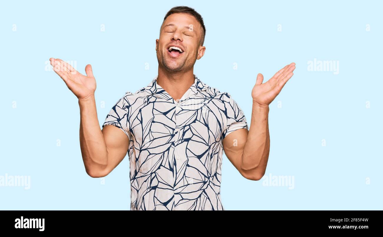 Handsome muscle man wearing casual clothes celebrating mad and crazy ...