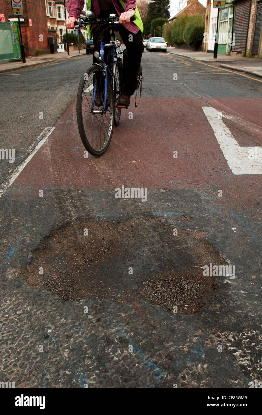 Bikes and Potholes 2/2/07 Tom Pilston Stock Photo - Alamy