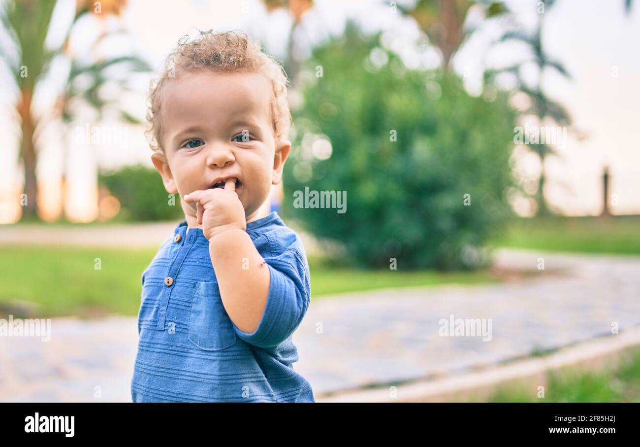 Baby chewing on fingers hi-res stock photography and images - Alamy