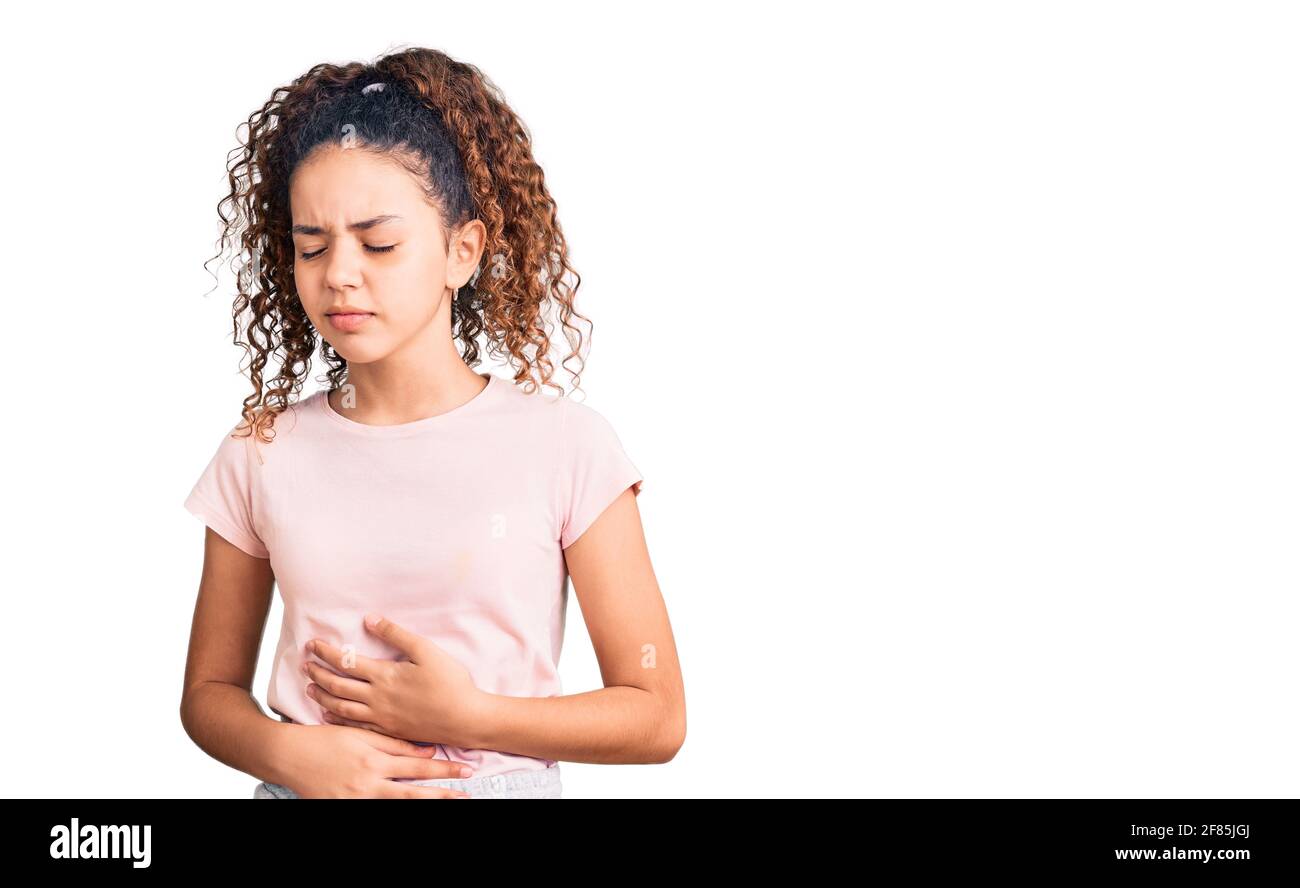 Beautiful kid girl with curly hair wearing casual clothes with hand on ...