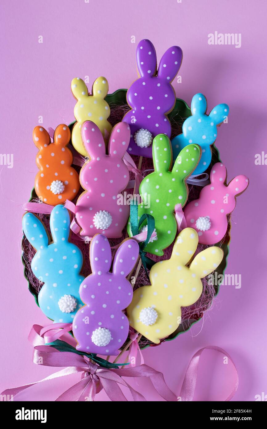 Bouquet of Easter gingerbread toppers in the form of cute rabbits on a ...