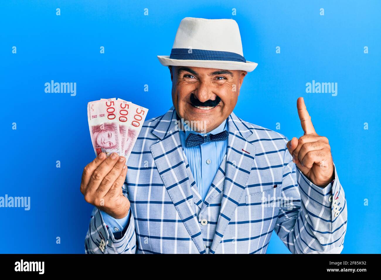 Mature middle east man with mustache wearing elegant vintage style ...