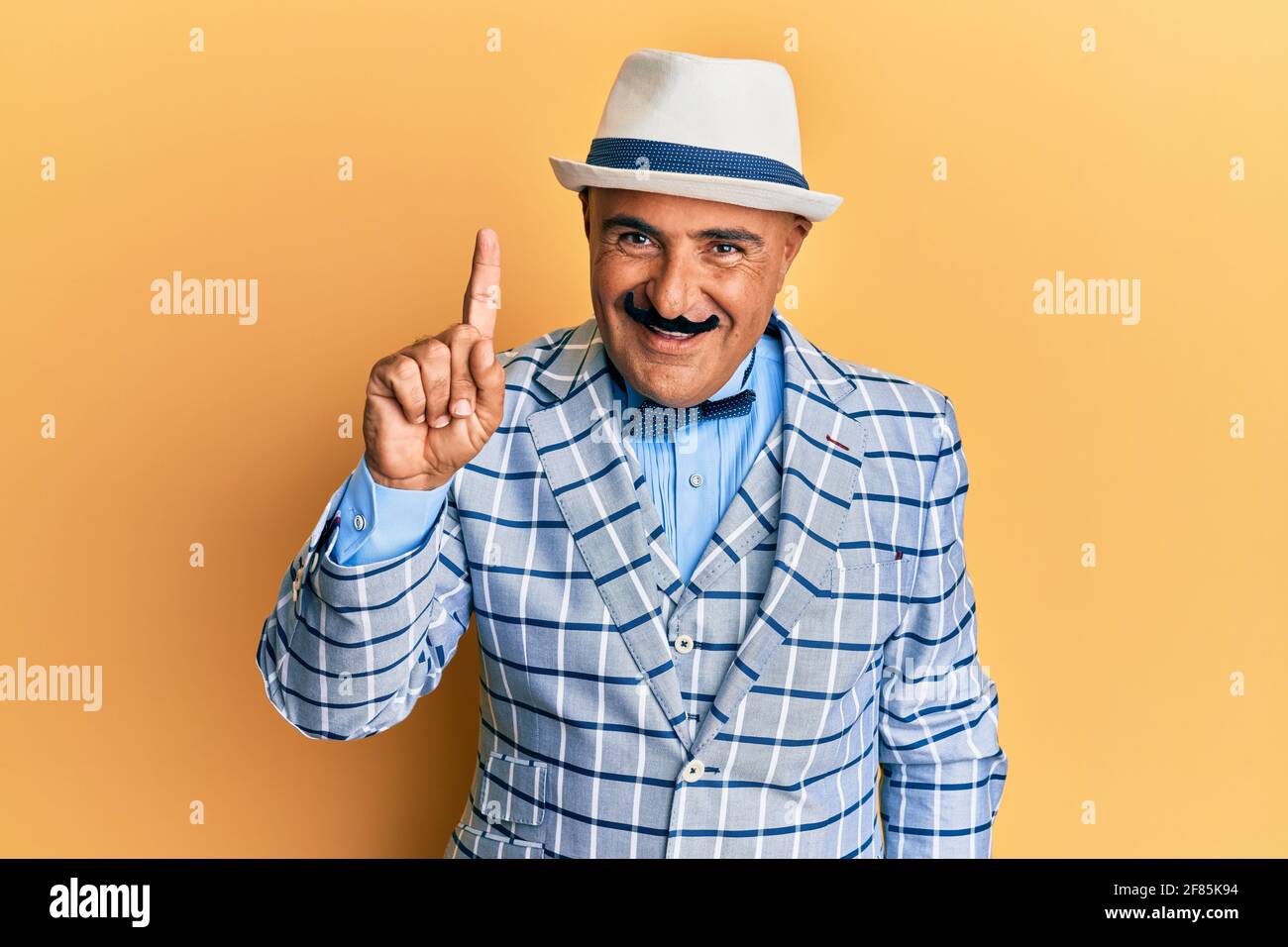 Mature middle east man with mustache wearing vintage and elegant ...