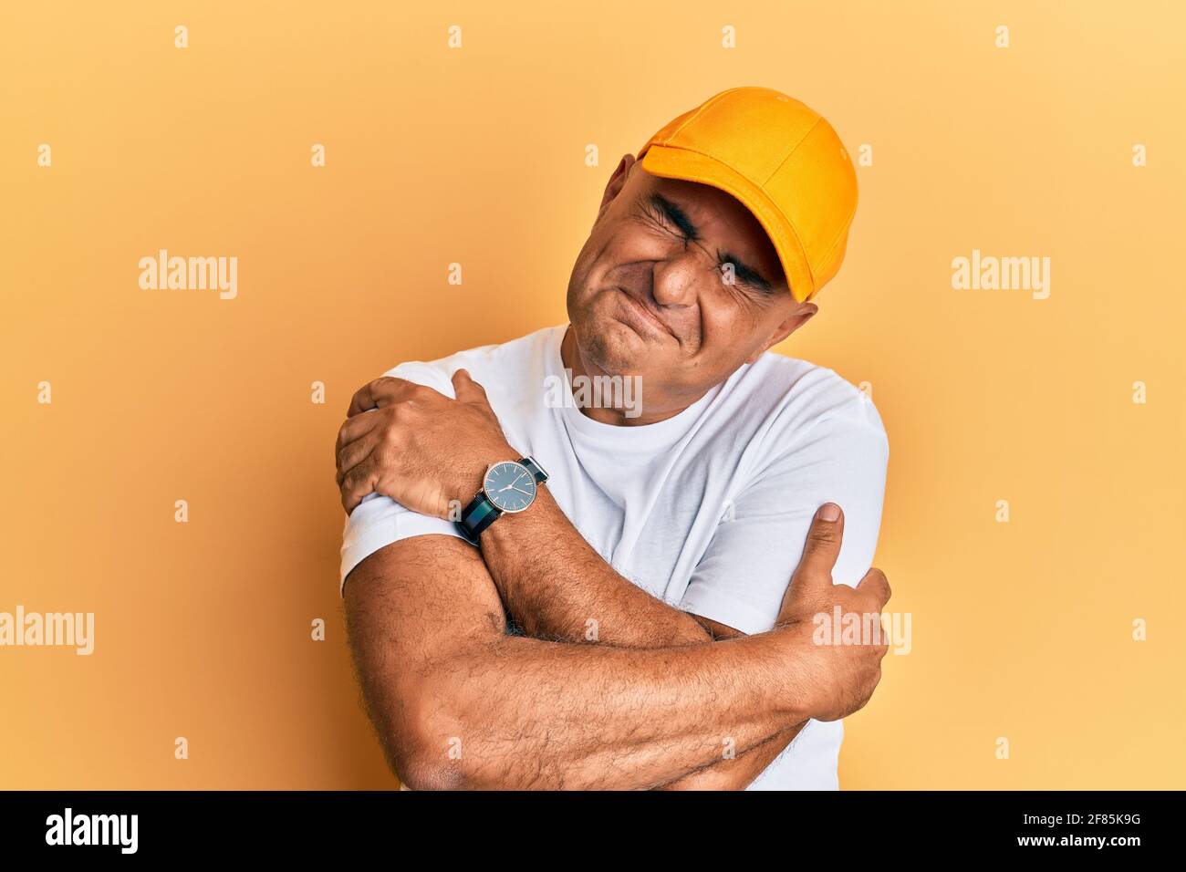 Mature middle east man with mustache wearing casual white tshirt and ...