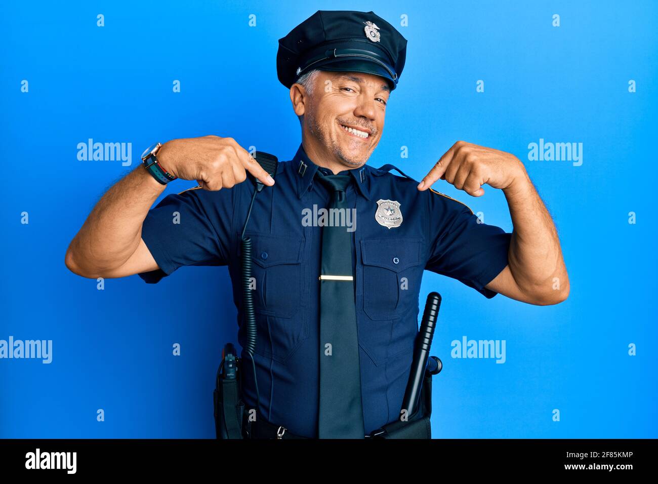 Handsome middle age mature man wearing police uniform looking confident ...