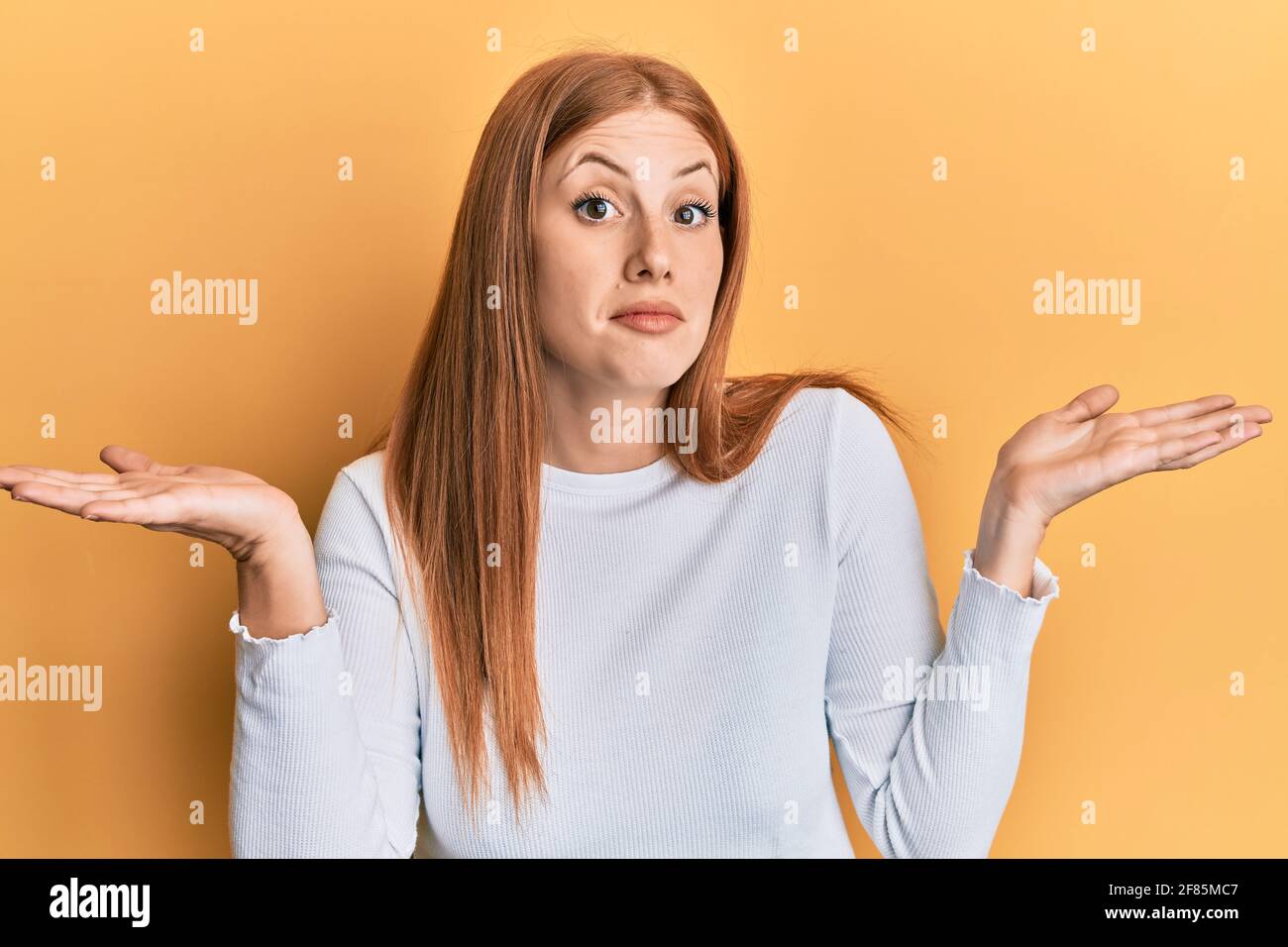 Young irish woman wearing casual clothes clueless and confused with ...