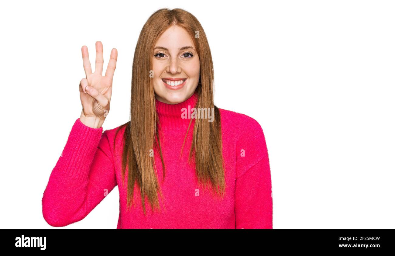 Young irish woman wearing casual clothes showing and pointing up with ...