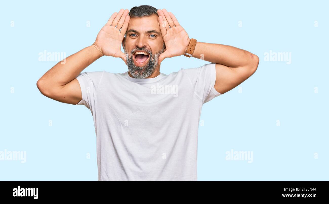 Middle age handsome man wearing casual white tshirt smiling cheerful ...