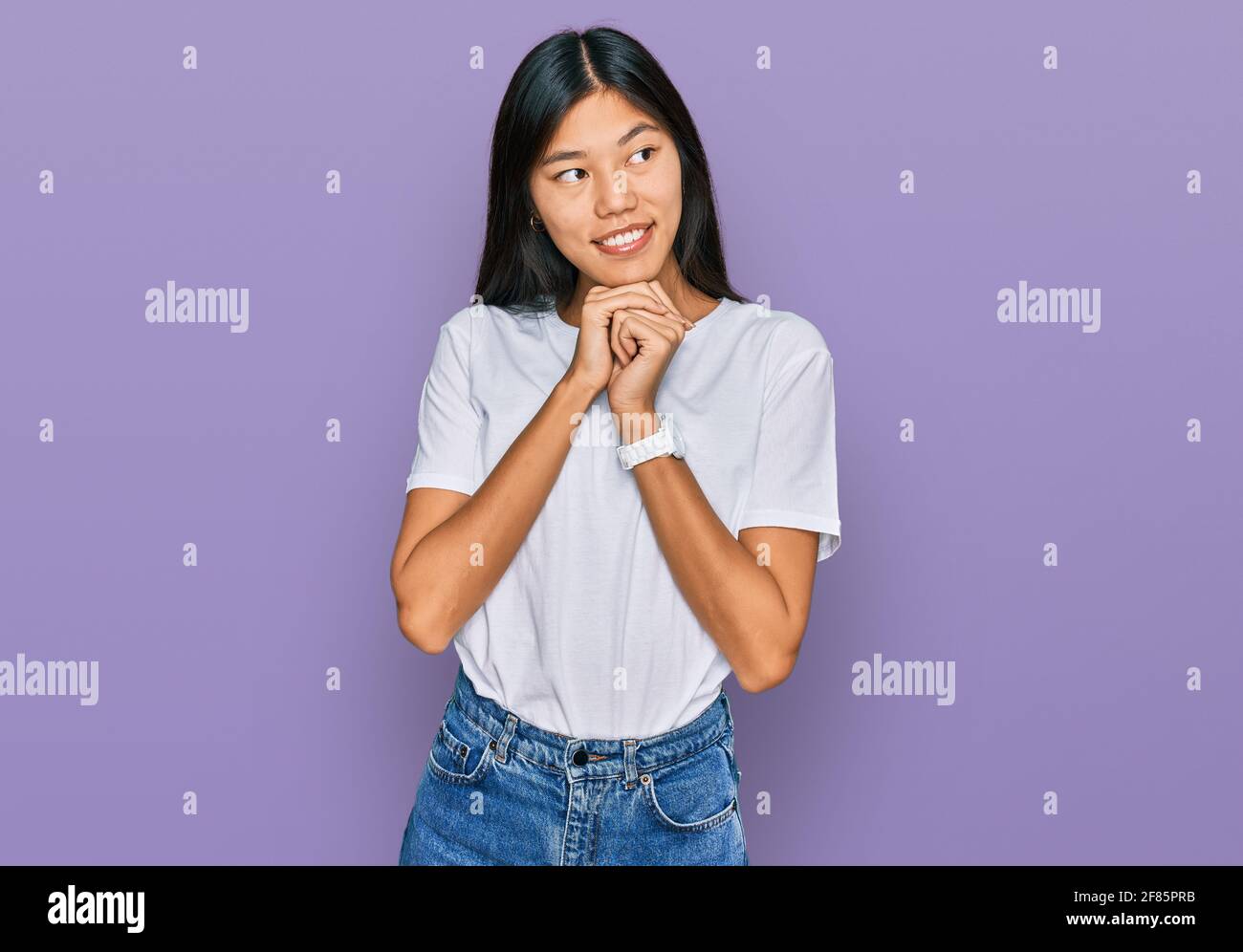 Happy young asian woman giggling hi-res stock photography and images ...